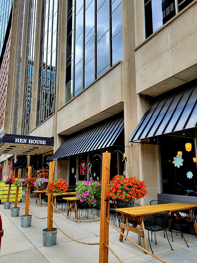 The blue awning of Hen House beckons like a breakfast lighthouse in downtown Minneapolis, promising morning salvation for hungry city dwellers.