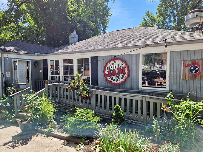 The unassuming gray exterior of Nashville Jam Co. is like finding a secret breakfast club where the password is "hungry" and everyone gets in.