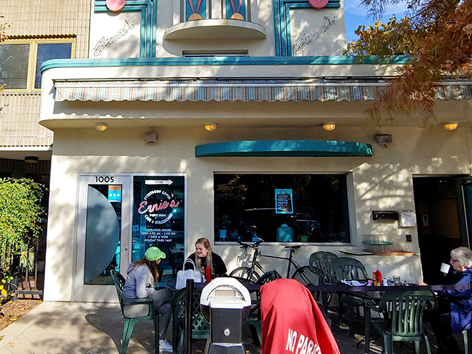 Ernie's welcoming exterior beckons with its classic green awning and outdoor seating—a Columbia landmark where breakfast dreams come true.