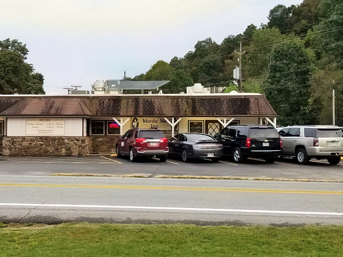 The unassuming exterior of Monte Ne Inn Chicken belies the culinary magic happening inside. Pilgrims of perfect poultry gather at dusk, drawn by decades of delicious reputation.