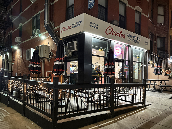 The storefront beckons like a lighthouse for hungry souls, its classic red and blue signage promising salvation from mediocre chicken since 1990.