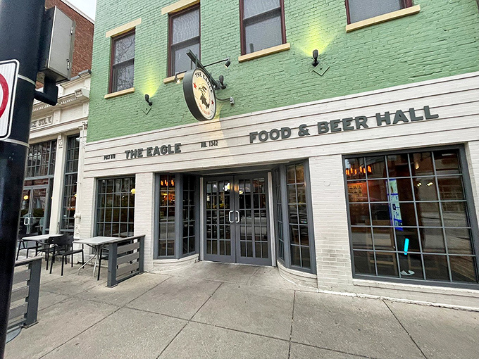 The mint-green facade of The Eagle OTR stands out like a culinary beacon on Vine Street, promising Southern comfort in Cincinnati's historic district.