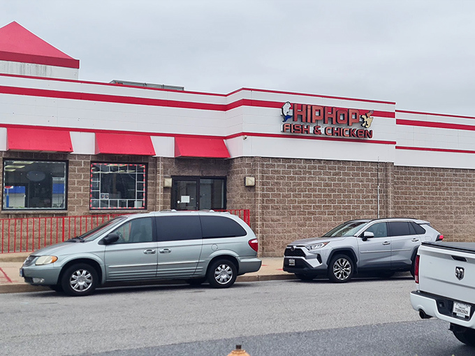 The red and white exterior of Hip Hop Fish & Chicken stands out like a beacon of fried goodness on Baltimore's landscape. Culinary treasures await inside!