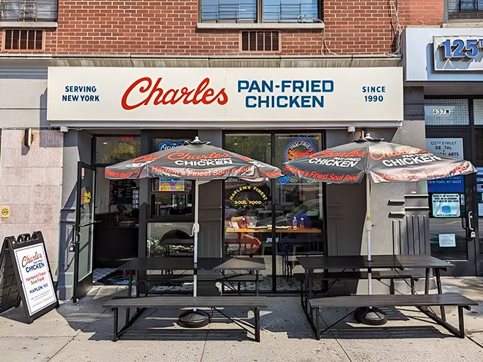 The storefront beckons like a lighthouse for hungry souls, its classic red and blue signage promising salvation from mediocre chicken since 1990.