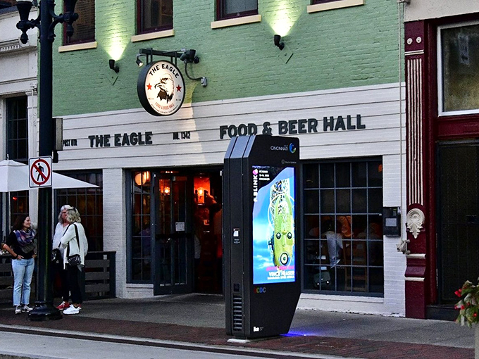 The mint-green facade of The Eagle OTR stands out like a culinary beacon on Vine Street, promising Southern comfort in Cincinnati's historic district.