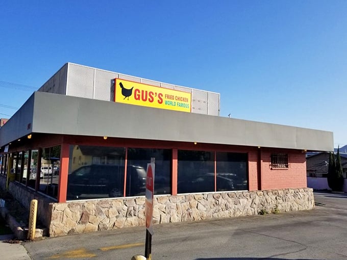 The coral-colored building with its bold yellow sign makes no apologies for its confidence. Like a Southern gentleman declaring his intentions, Gus's announces itself with charming audacity.