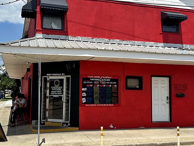 The red and white exterior of Chicken's Kitchen stands like a culinary lighthouse on Derbigny Street, beckoning hungry souls with promises of crispy perfection.
