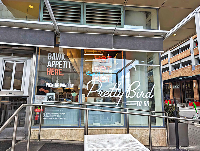 The "BAWK APPETIT HERE" sign says it all&mdash;Pretty Bird's storefront promises chicken nirvana with a side of clever wordplay.