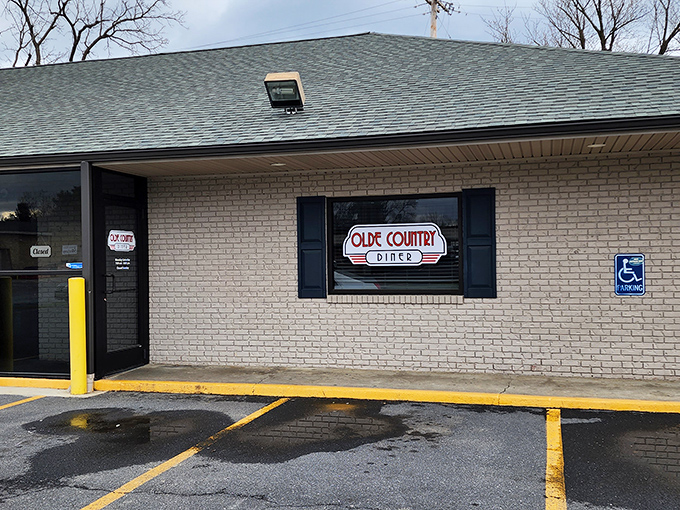 The unassuming brick exterior of Olde Country Diner proves once again that culinary treasures often hide behind the most modest facades.