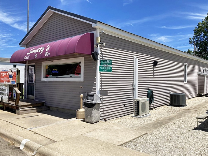 The pink awning of Smitty's beckons like a neon promise in rural Illinois&mdash;small-town charm with big-time flavor waiting just beyond that door.