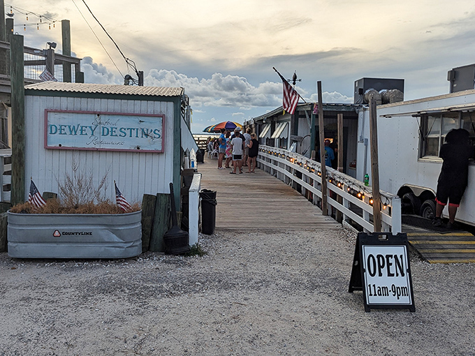 The entrance to seafood paradise begins with this unassuming wooden walkway. Like all great Florida treasures, Dewey Destin's doesn't need to shout about its brilliance.