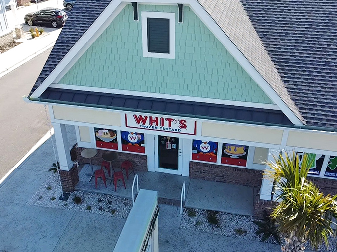 The mint-green beach cottage with its cheerful "WHIT'S FROZEN CUSTARD" sign promises sweet relief from the Carolina heat. Vacation mode: activated.