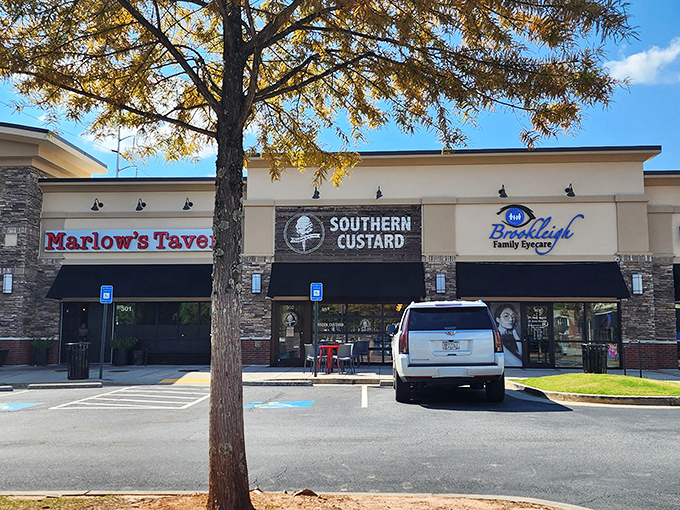 Southern Custard's storefront beckons with its sleek black awning and stone accents. The crowd outside tells you everything you need to know&mdash;this place is worth the wait.