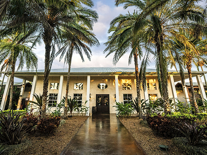 Palm trees line the path to Schnebly's elegant entrance, where Florida sunshine meets Mediterranean charm. Paradise awaits beyond those doors.
