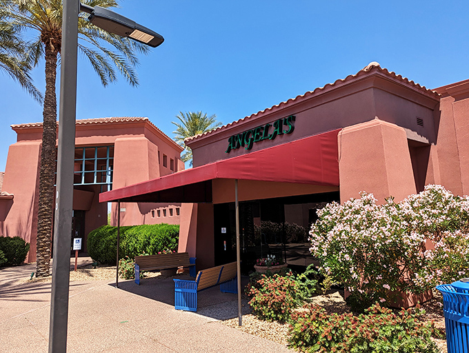 Angela's Kitchen welcomes you with its warm terracotta exterior and inviting red awning&mdash;a culinary oasis amid the Arizona desert landscape.