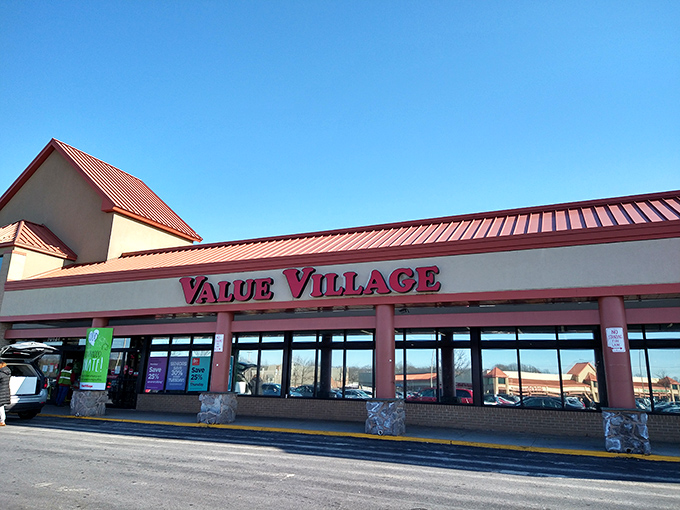 The iconic red Value Village sign welcomes treasure hunters to this suburban Maryland thrift mecca, where bargains await behind those unassuming glass doors.