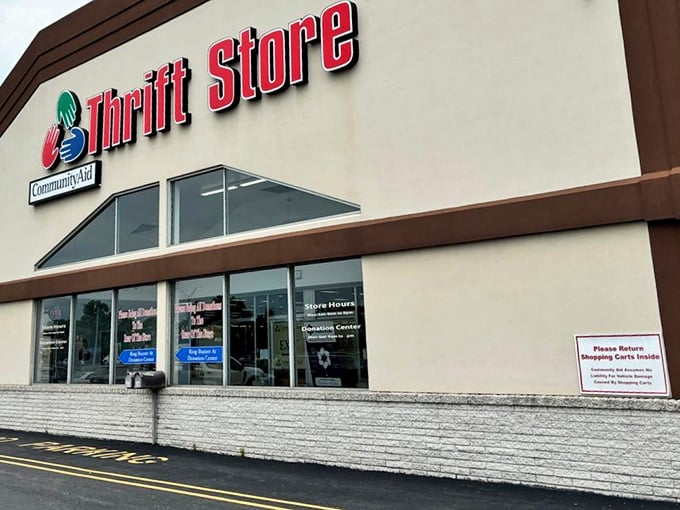 The red signage beckons like a lighthouse to bargain hunters. CommunityAid's exterior promises treasure hunting adventures within those unassuming walls.