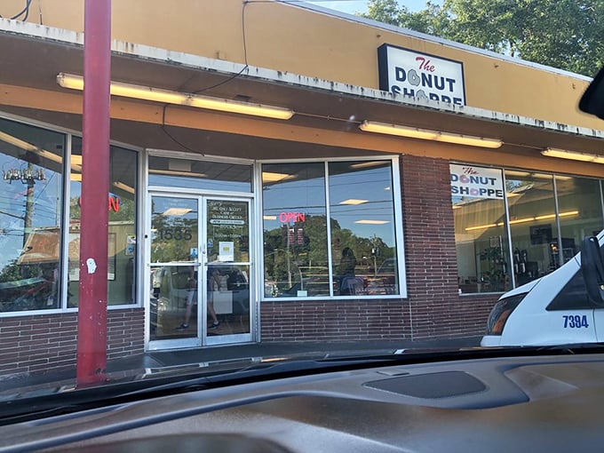 The unassuming storefront of The Donut Shoppe stands as a beacon of sweet salvation for Jacksonville's early risers. No fancy frills, just donut thrills.