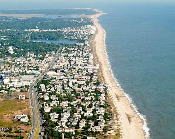 Aerial paradise! Dewey Beach stretches like nature's welcome mat between ocean and bay, a slender slice of coastal heaven.