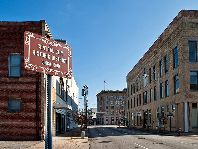 Historic brick buildings stand sentinel at this downtown intersection, where time seems to move at its own comfortable pace.