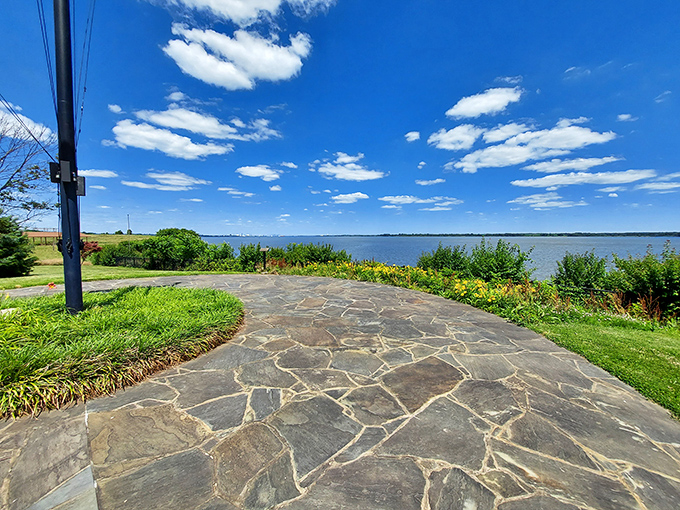 The winding riverside path beckons like nature's welcome mat, inviting you to leave your worries at the entrance sign and just breathe.