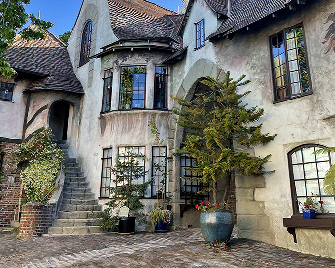 Stone archways and weathered walls create an entrance that would make medieval architects weep with envy.