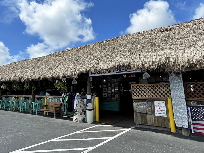 The thatched-roof tiki paradise beckons from the parking lot, promising seafood treasures and tropical escapes just steps away from everyday life.