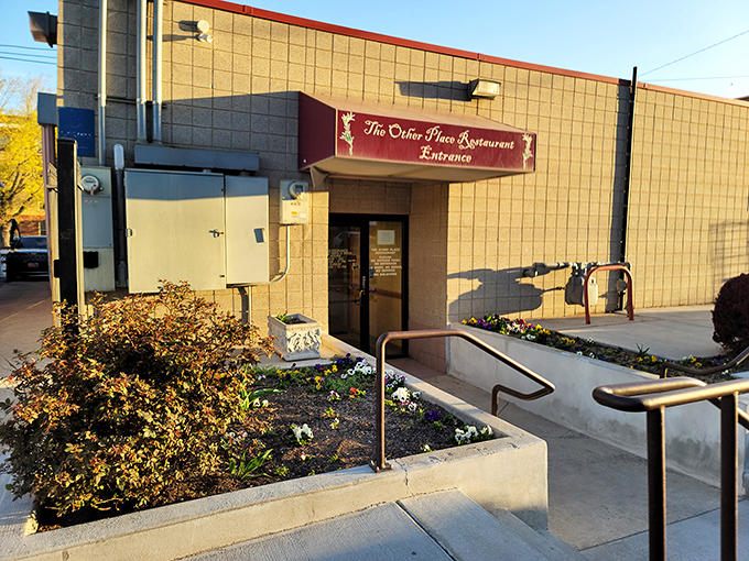 The unassuming exterior of The Other Place Restaurant proves that culinary treasures often hide behind modest facades. Greek greatness awaits inside!