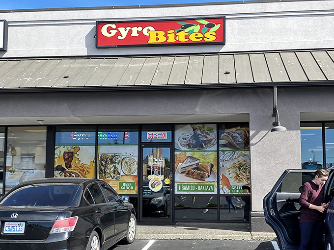 The colorful Gyro Bites sign beckons like a Mediterranean lighthouse in a sea of strip mall sameness. No pretension, just promise. 