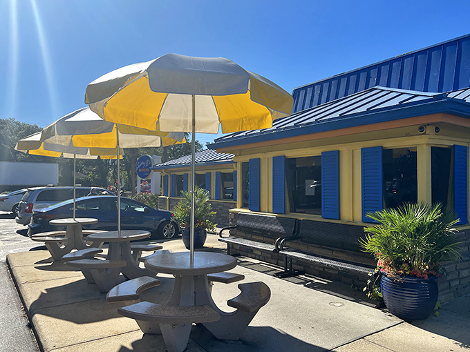 The bright blue roof and cheerful yellow walls of Johnny D's beckon like a breakfast lighthouse, promising delicious refuge from ordinary morning meals.