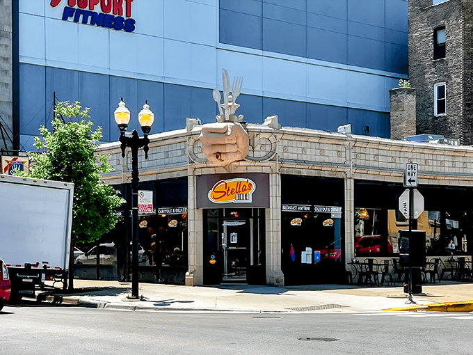 The iconic fist clutching silverware announces your arrival at hash brown heaven. Stella's Diner stands proud on Chicago's North Side, beckoning hungry souls with its unmistakable sign.