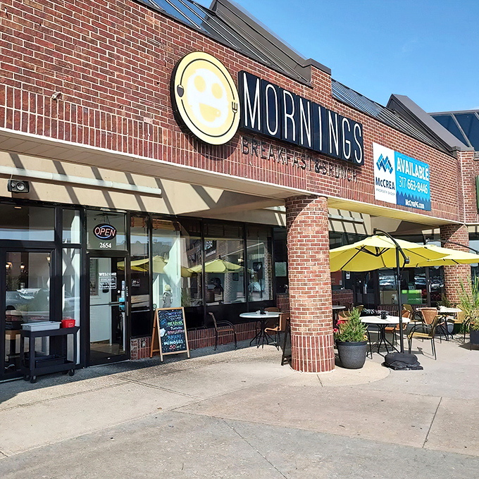 The cheerful yellow smiley face logo seems to know something you don't yet&mdash;that breakfast nirvana awaits behind those brick walls.
