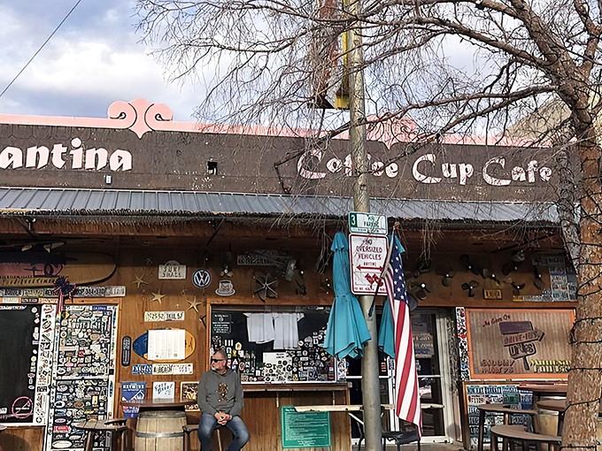 Sticker heaven meets breakfast paradise. The Coffee Cup Cafe's exterior is a visual feast of memorabilia that promises the culinary adventure waiting inside.
