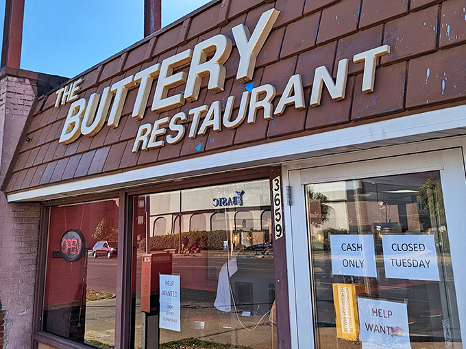 The unassuming brown exterior of The Buttery Restaurant stands as a beacon to breakfast aficionados who know that culinary treasures often hide in plain sight.