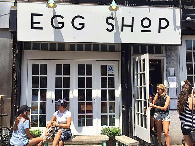 The minimalist white storefront of Egg Shop beckons like a breakfast beacon on Elizabeth Street, promising eggy delights within those French doors.