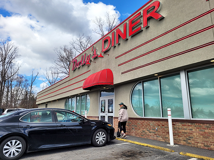 The classic red signage of Dolly's Diner beckons like a lighthouse for the breakfast-starved. This retro exterior promises comfort food without pretension.