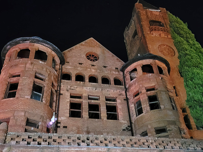 The imposing red brick facade of Preston Castle stands as a magnificent time capsule, its Romanesque revival architecture creating an unexpected European silhouette against California's golden foothills.