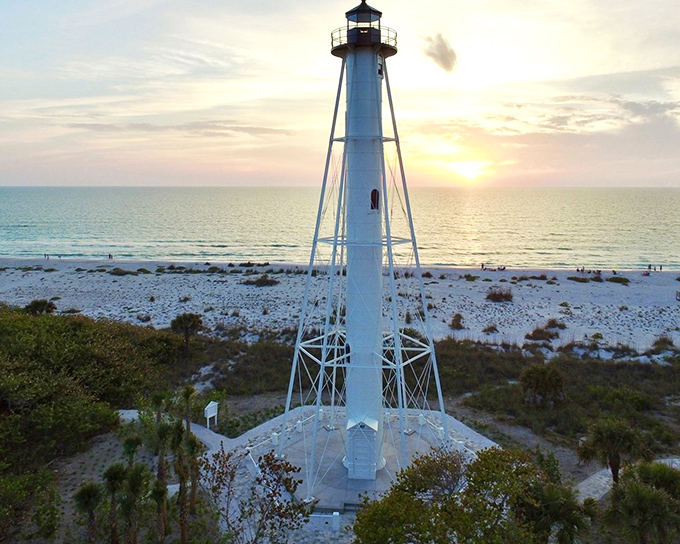 Sunset magic at its finest! The skeletal frame of Gasparilla Island Lighthouse creates a perfect silhouette against Florida's cotton candy skies, promising adventures for tomorrow.