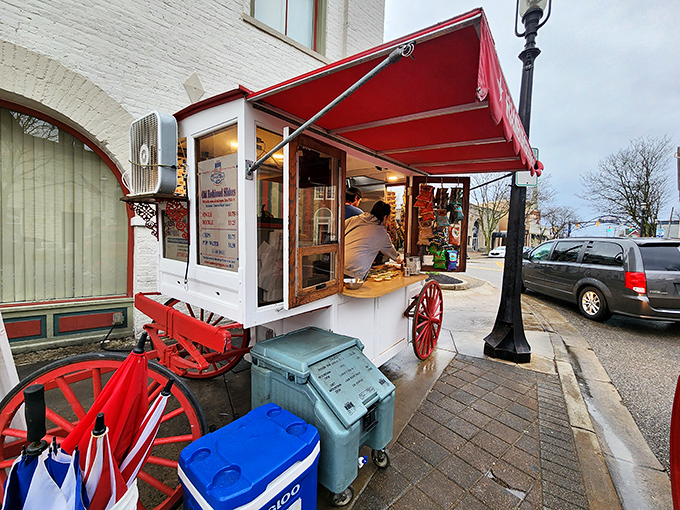 The iconic Hamburger Wagon stands proudly on Miamisburg's Main Street, its red awning and wagon wheels a beacon for burger enthusiasts since 1913. 