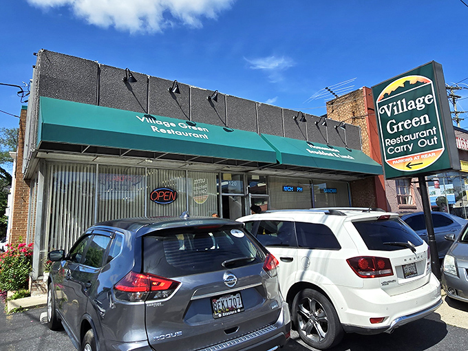 The iconic green awning of Village Green Restaurant stands as a beacon of breakfast hope in Gaithersburg. No frills, just promises of good food within.