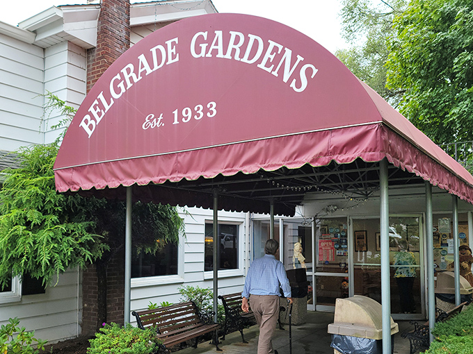 The iconic burgundy awning welcomes hungry pilgrims to Belgrade Gardens, where Barberton's fried chicken legacy has been sizzling since 1933.