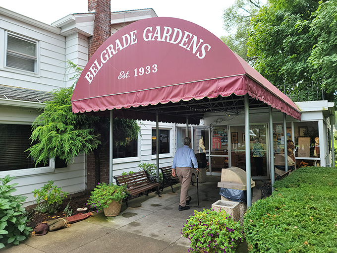 The iconic burgundy awning of Belgrade Gardens welcomes hungry pilgrims like a culinary lighthouse that's been guiding fried chicken enthusiasts since 1933.