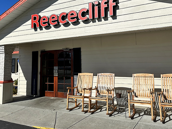 The unassuming yellow exterior of Reececliff Family Diner, with its wooden rocking chairs, promises comfort food magic that generations of Lakeland locals have treasured.
