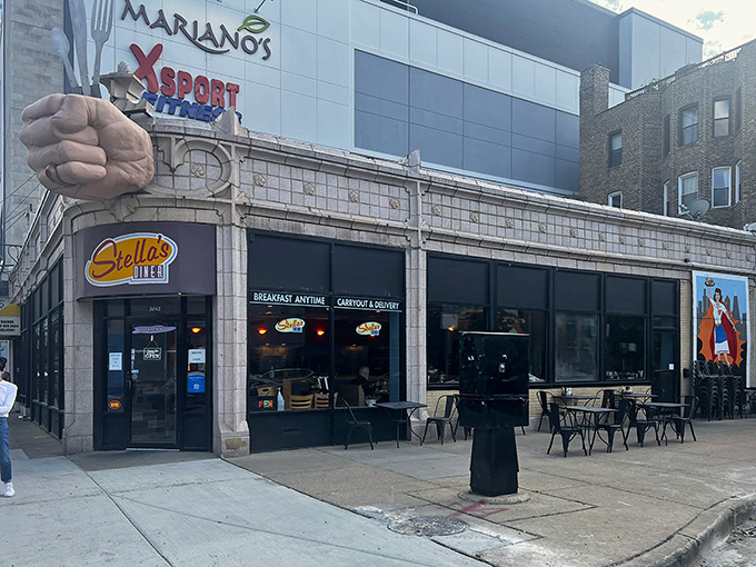 The iconic fist clutching silverware announces your arrival at hash brown heaven. Stella's Diner stands proud on Chicago's North Side, beckoning hungry souls with its unmistakable sign.