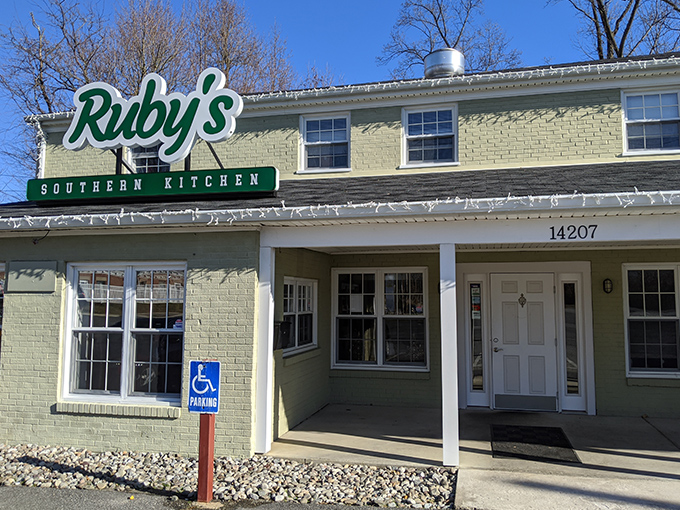 Ruby's glows like a beacon of Southern promise against the night sky, beckoning hungry travelers with its sleek exterior and warm lighting. 