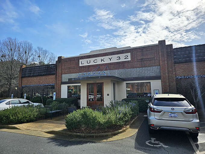 The brick facade of Lucky 32 stands like a Southern sentinel, promising culinary treasures within. No wonder folks make the pilgrimage from across the state. 
