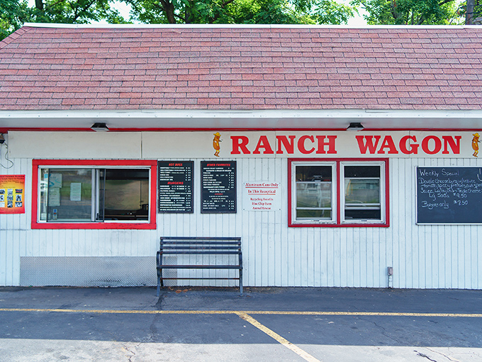 The unassuming white exterior with bold red lettering promises no frills, just thrills for your taste buds. Roadside perfection awaits.