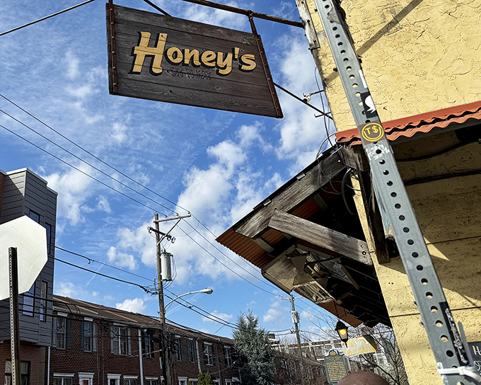 That weathered wooden sign hanging above Honey's entrance isn't just decoration&mdash;it's a beacon for breakfast enthusiasts seeking Philadelphia's best-kept culinary secret.