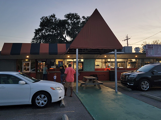 The iconic triangular roof of Jimbo's stands like a barbecue bat-signal, beckoning hungry travelers to this Lakeland landmark.