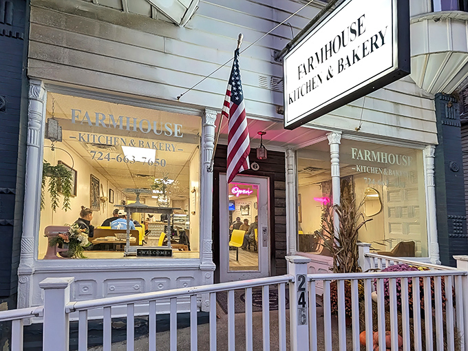 The classic American flag waves proudly outside this charming white storefront, where breakfast dreams come true and calories don't count until tomorrow.